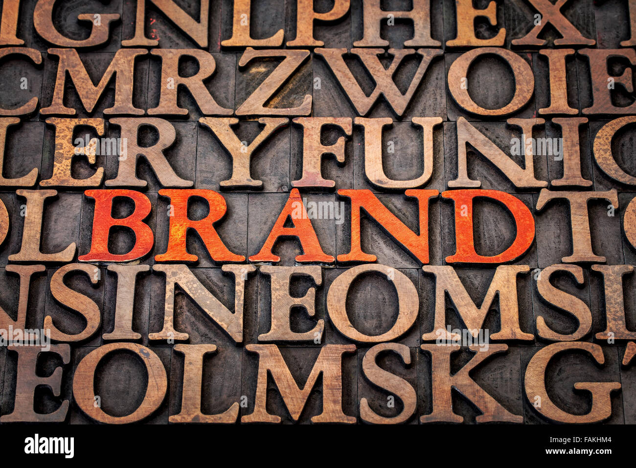 brand word abstract in wood type printing blocks stained by red ink ...
