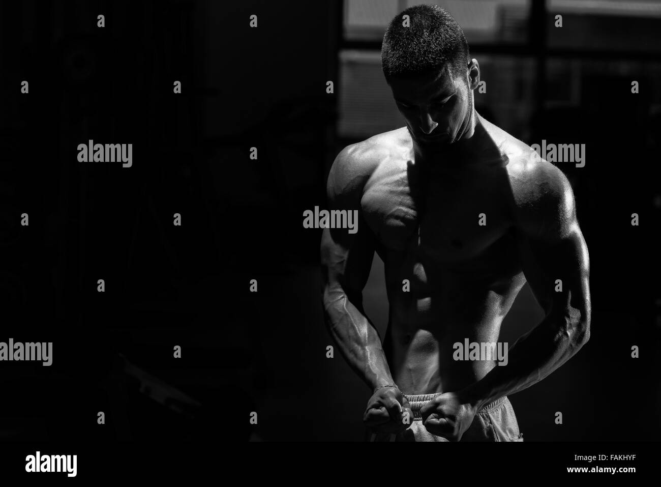 Muscular athlete in dark room hi-res stock photography and images - Alamy