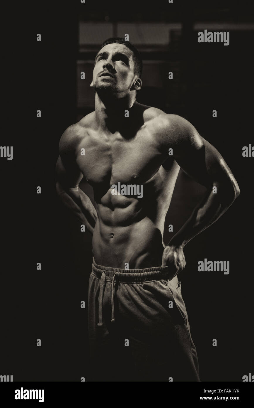Athlete Muscular Brutal Bodybuilder Emotional Posing In A Dark Gym ...