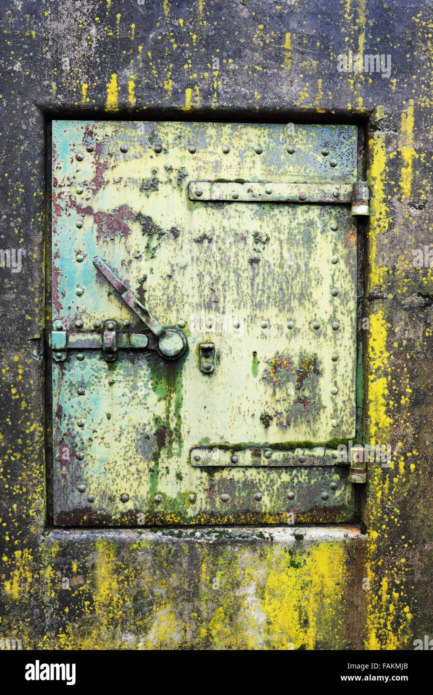 Closed rusty green steel door in concrete bunker window, Artillery Hill ...