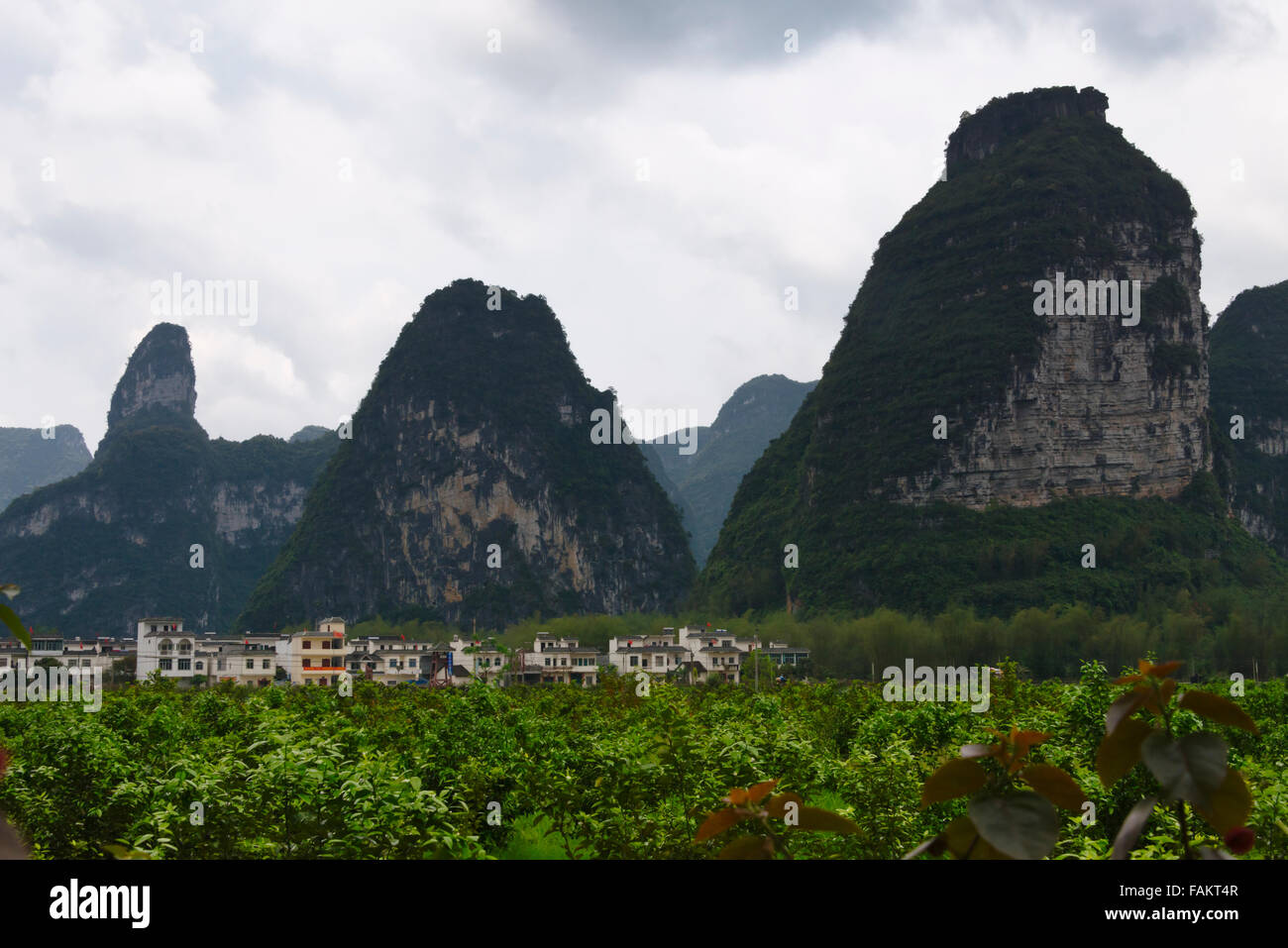 Karst hills and village houses, Mingshi, Guangxi Province, China Stock ...