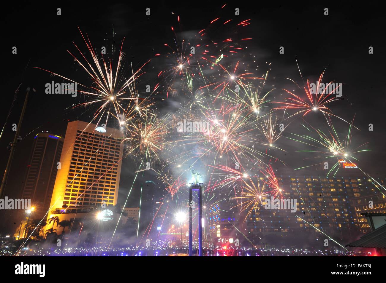 Jakarta, Indonesia. 31st Dec, 2015. Fireworks light up the sky as ...