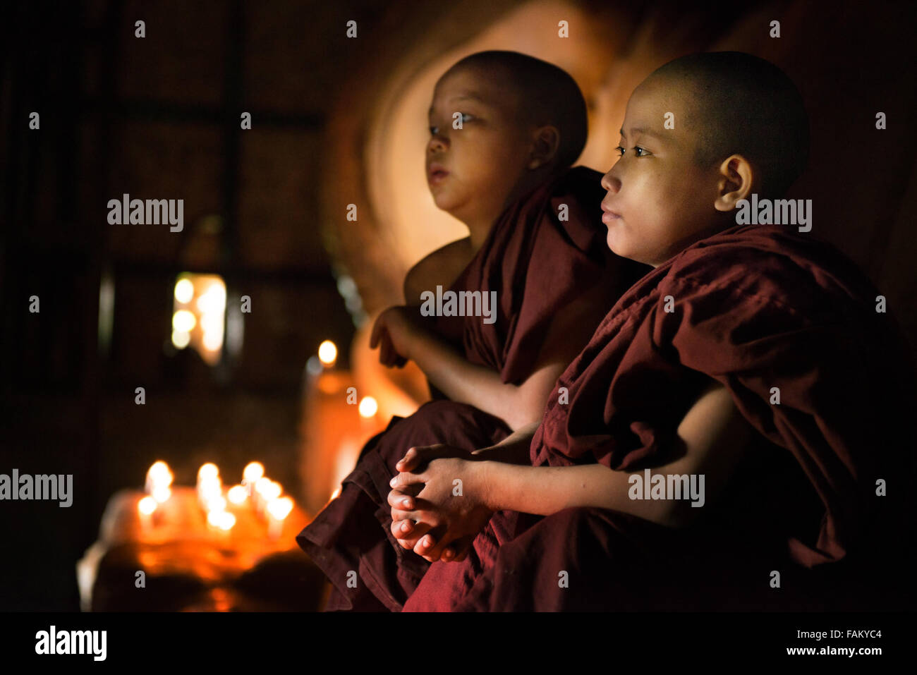 Novice monk sitting by temple hi-res stock photography and images - Alamy