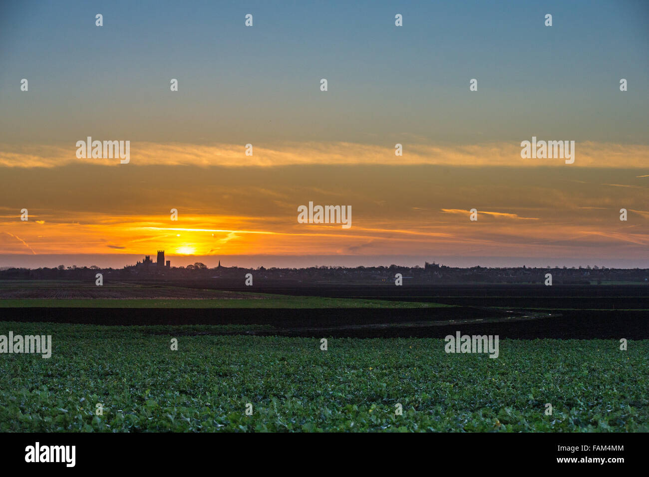 Ely Cathedral at sunrise with The Fens in the foreground Stock Photo ...