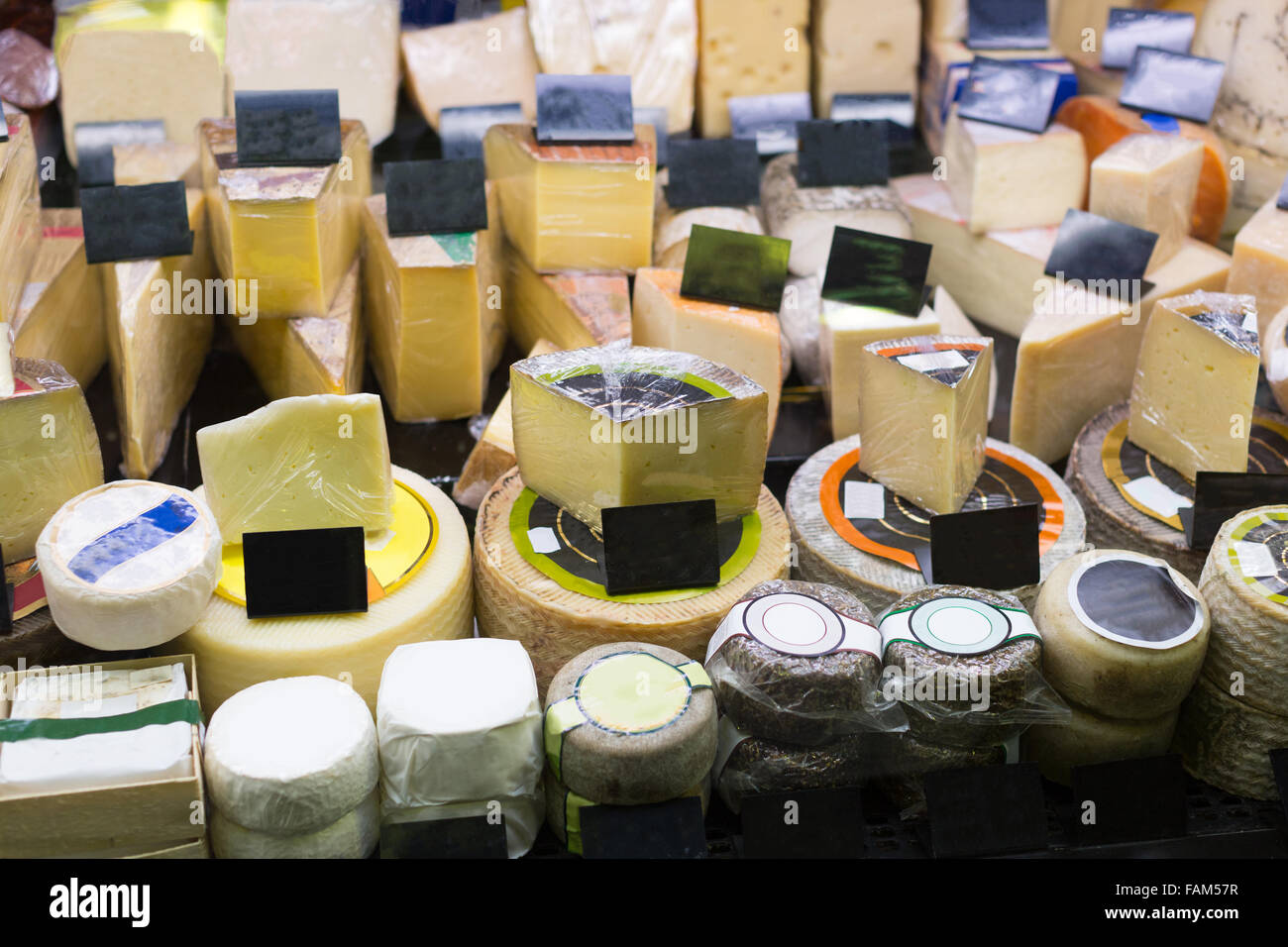 Assortment of appetizer European cheese at shop stand Stock Photo - Alamy