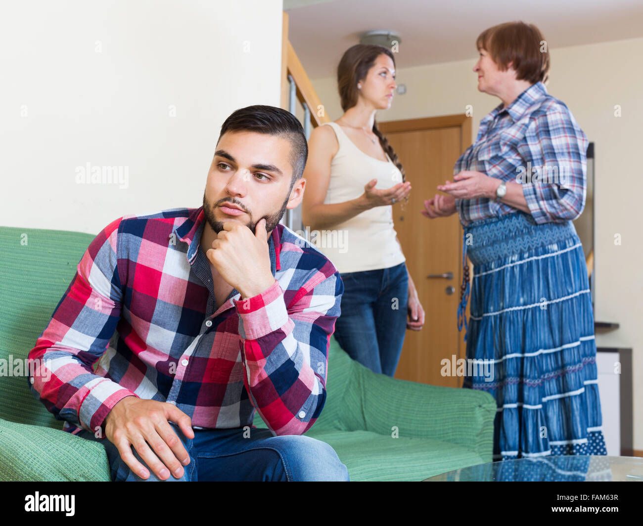 adult american family quarrels with the husbands mother Stock Photo - Alamy