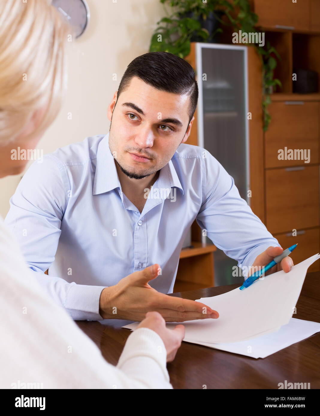 Financial crisis in family of sad adult son and senior mother Stock ...