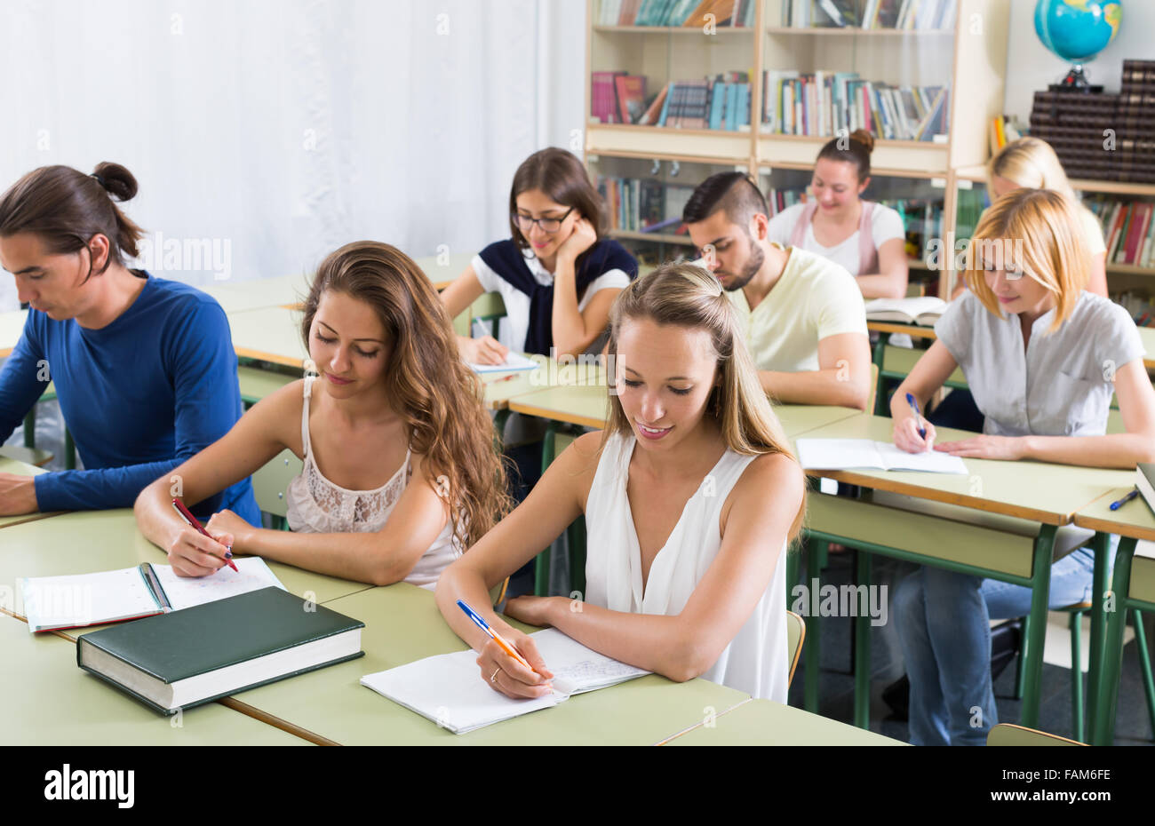 Group of american adult students working in a cozy classroom Stock ...