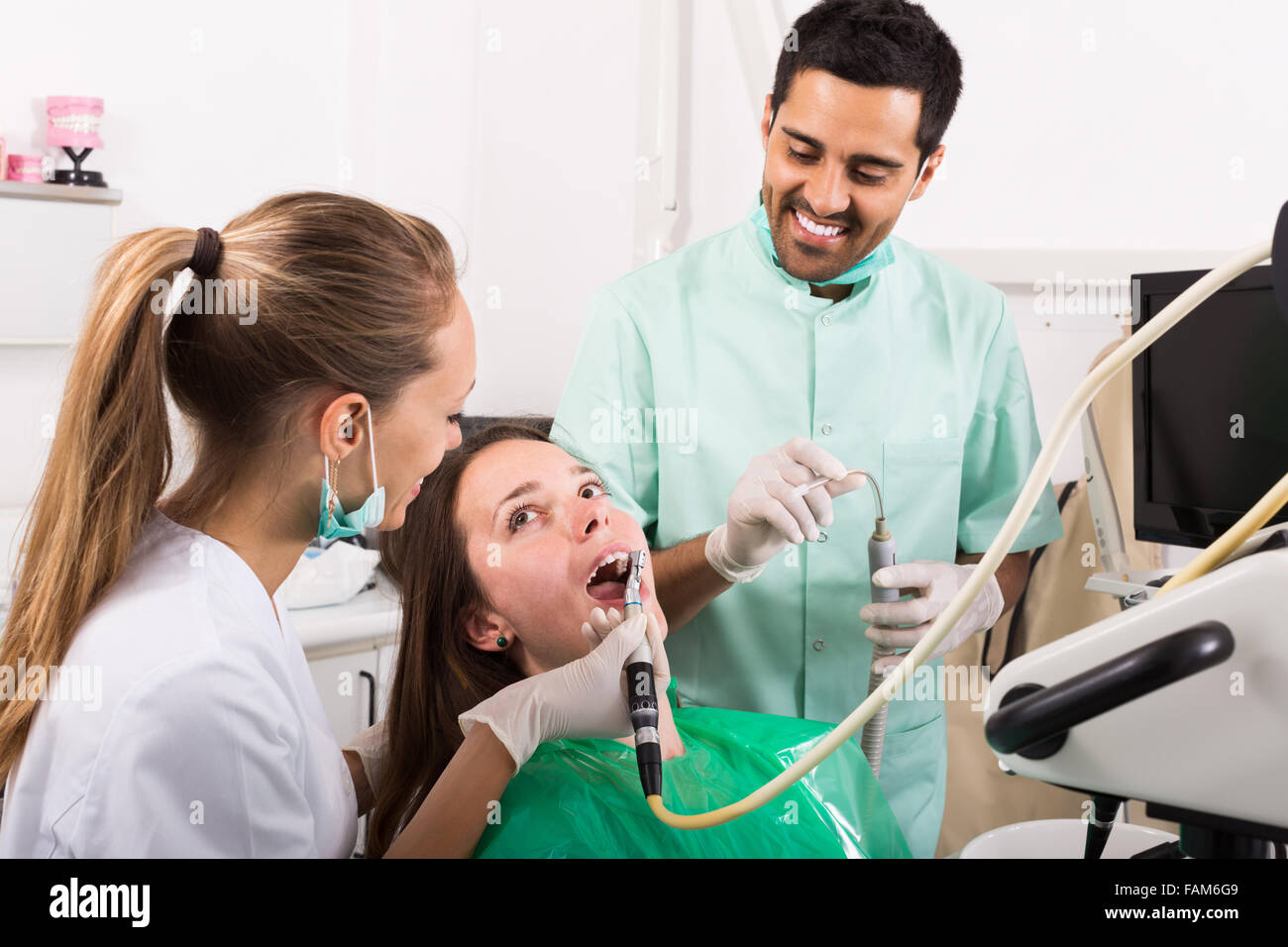 Sad adult patient checking out her teeth at dentist Stock Photo - Alamy
