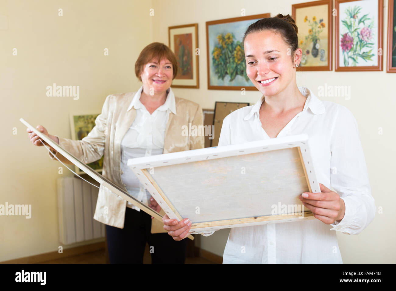Girl to do purchasing the creative picture in art gallery Stock Photo ...