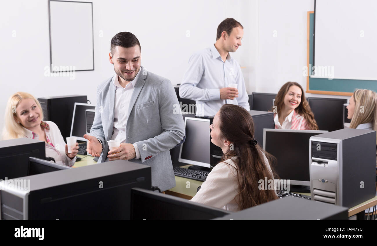 Smiling employees and manager celebrating good dealing. Focus on the ...