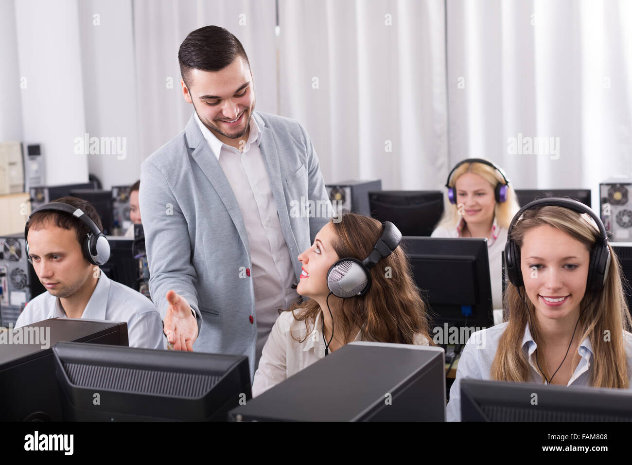 Happy boss and his call center team at office Stock Photo - Alamy