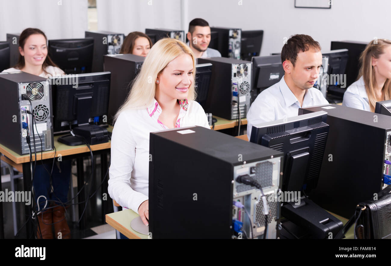 Positive manager watching his business team working process Stock Photo ...