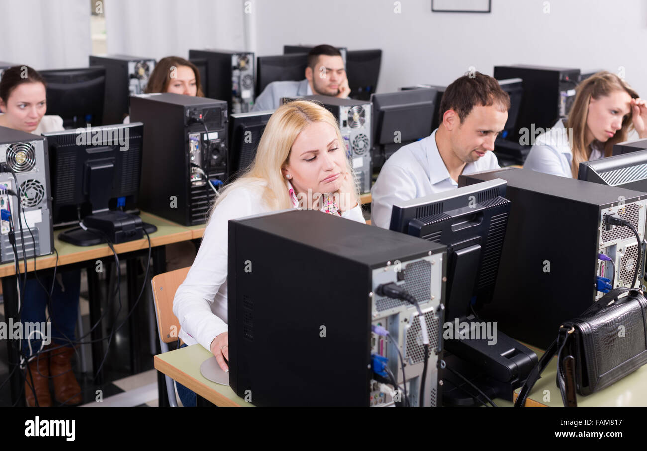 american staff sitting at desks and looking at PC screens Stock Photo ...