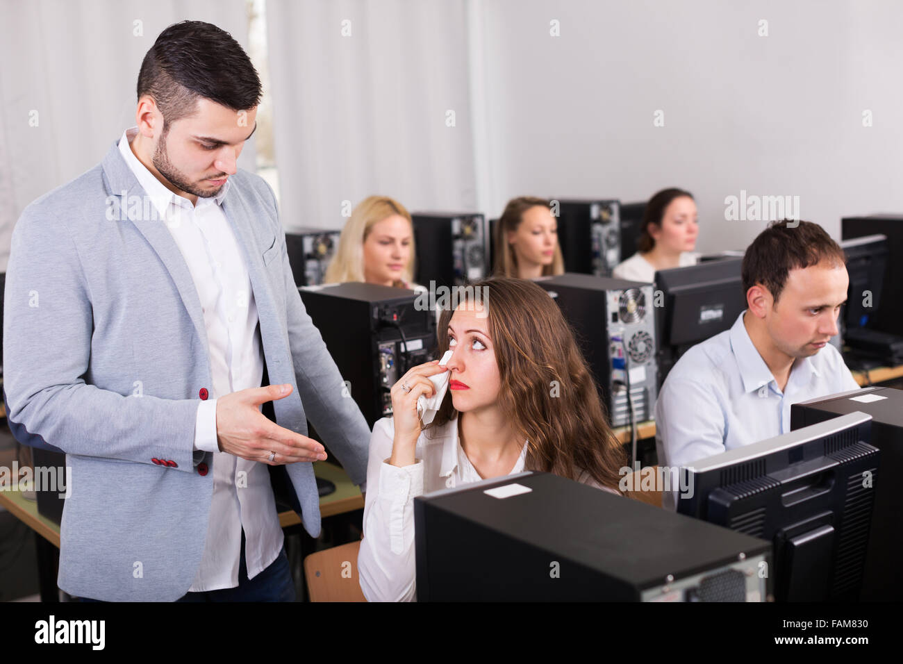 Furious manager scolding unhappy office worker Stock Photo - Alamy