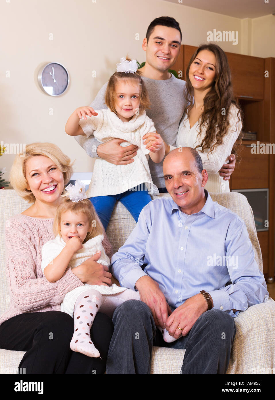 United family members laughing together in living room Stock Photo - Alamy