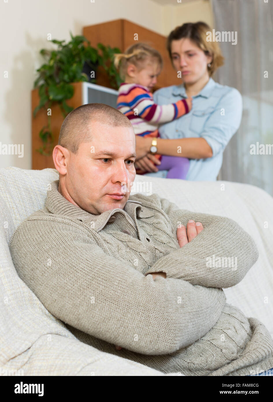 Family with crying little child having conflict at home Stock Photo - Alamy
