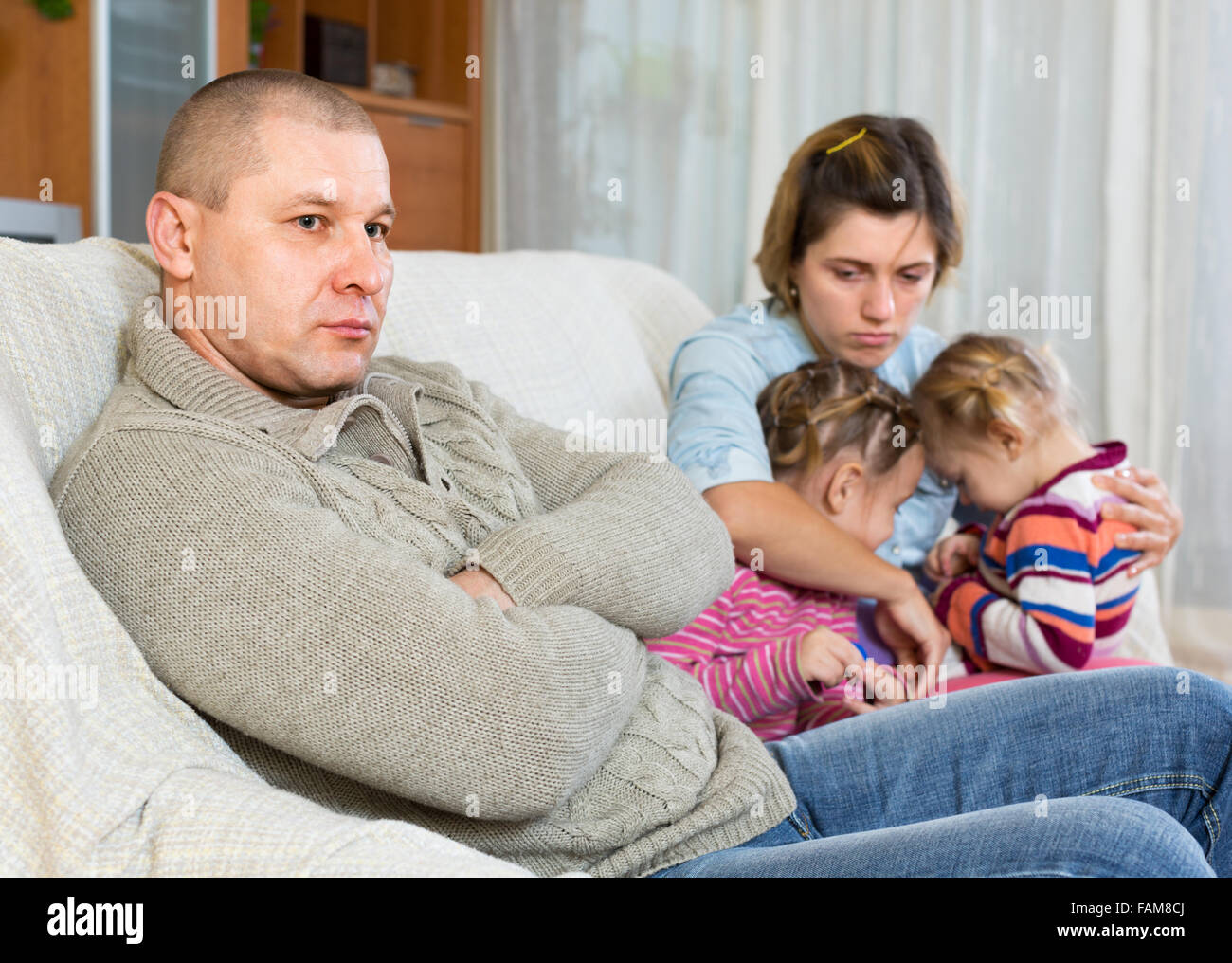 Family with two little children having conflict at home Stock Photo - Alamy