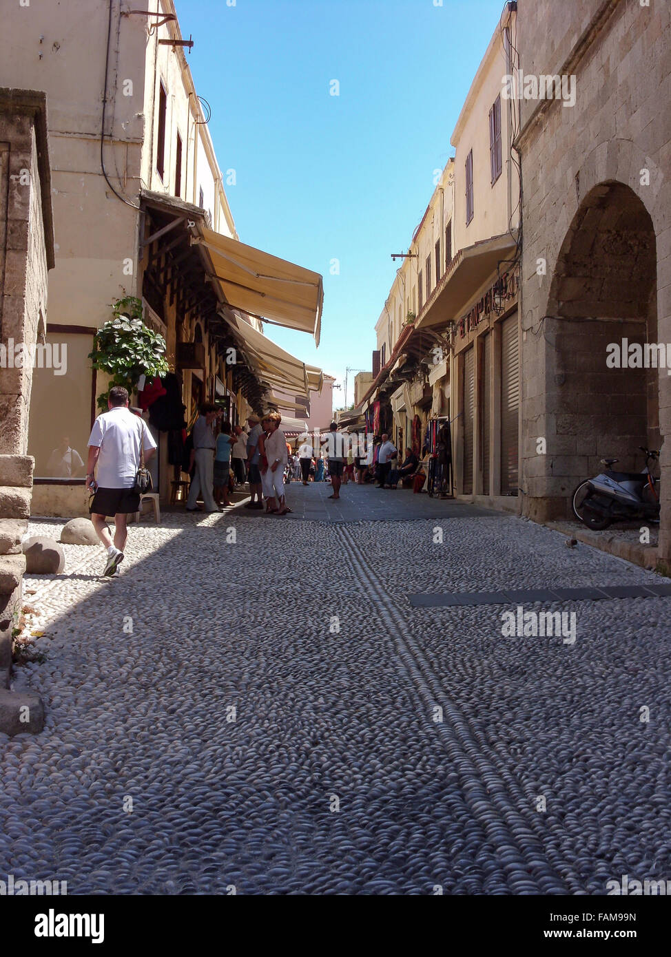 People wander the cobbled streets in Old Rhodes Town Greece Stock Photo ...