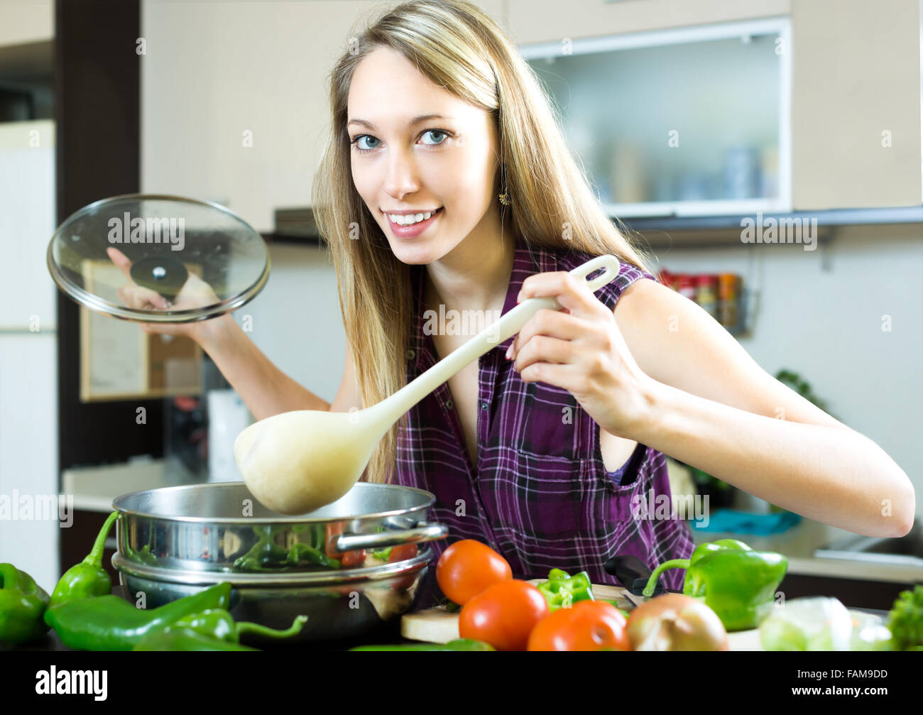 Woman cooking a healthy dinner from fresh vegetables Stock Photo - Alamy