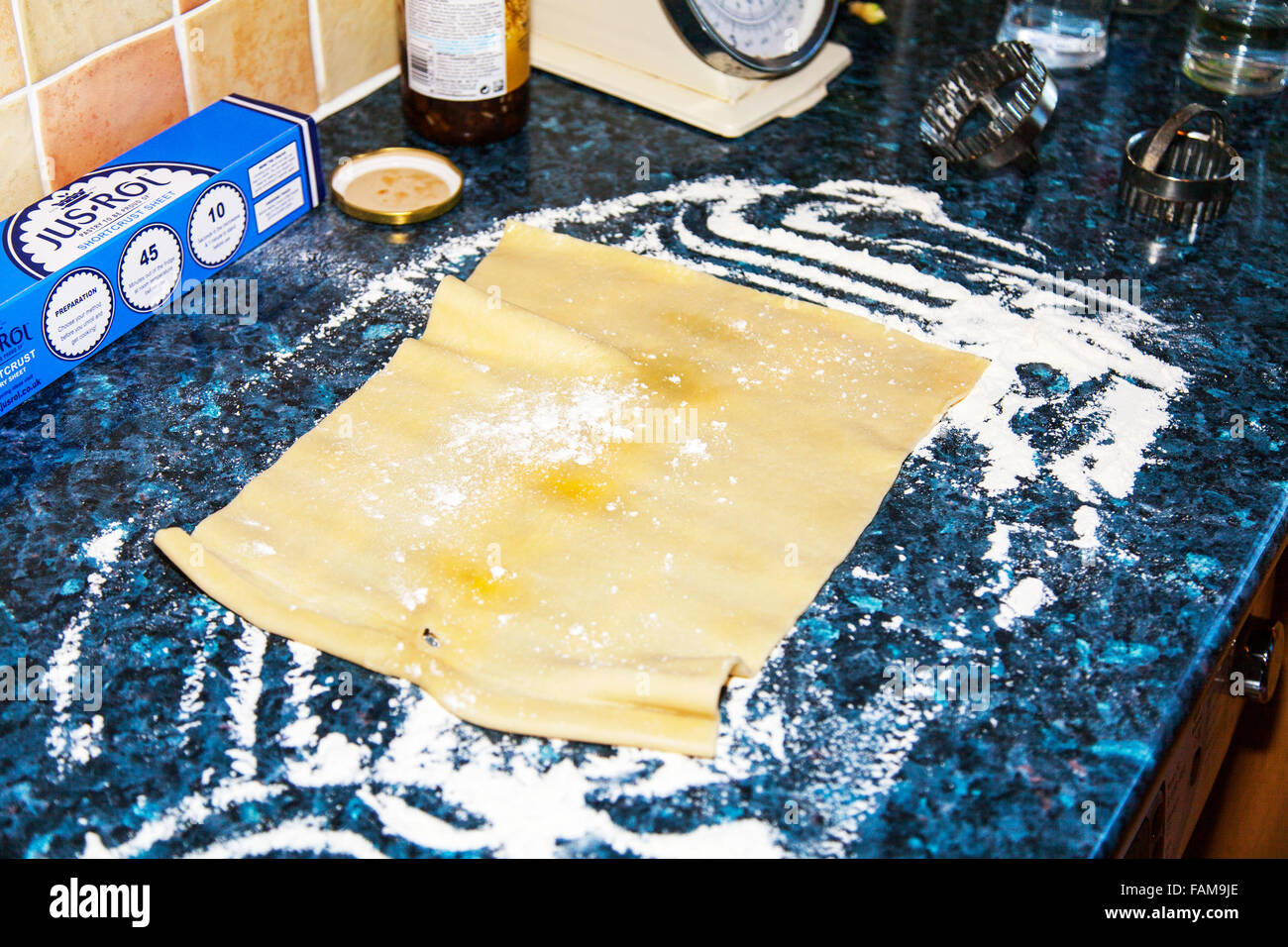 Pastry rolled out sheet ready for cutting flower kitchen worktop ...