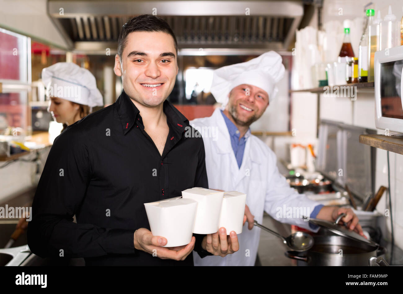 Portrait of happy customer, chef and cook at fastfood place Stock Photo ...