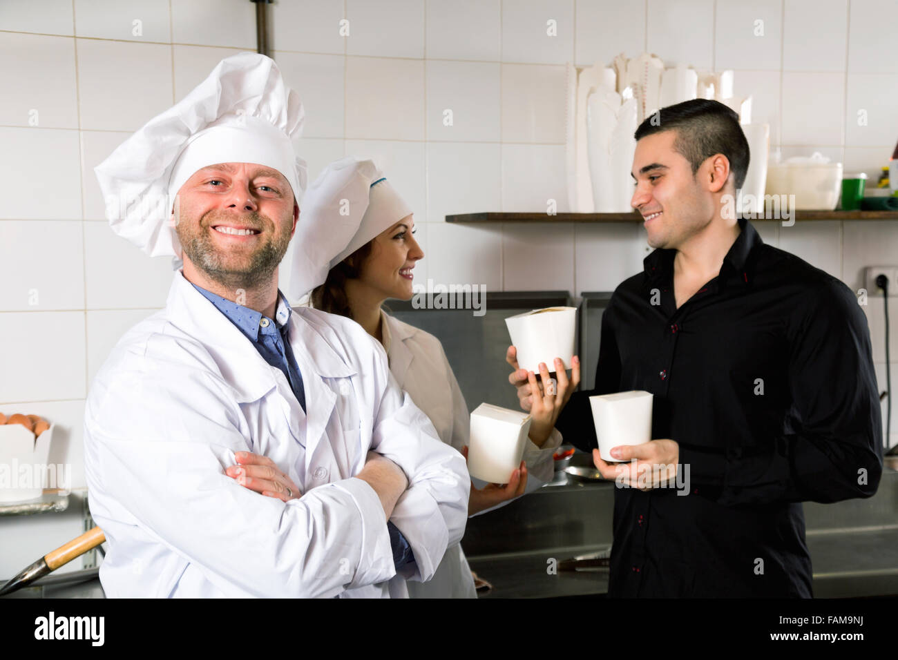 Happy customer, chef and cook at fastfood place Stock Photo - Alamy