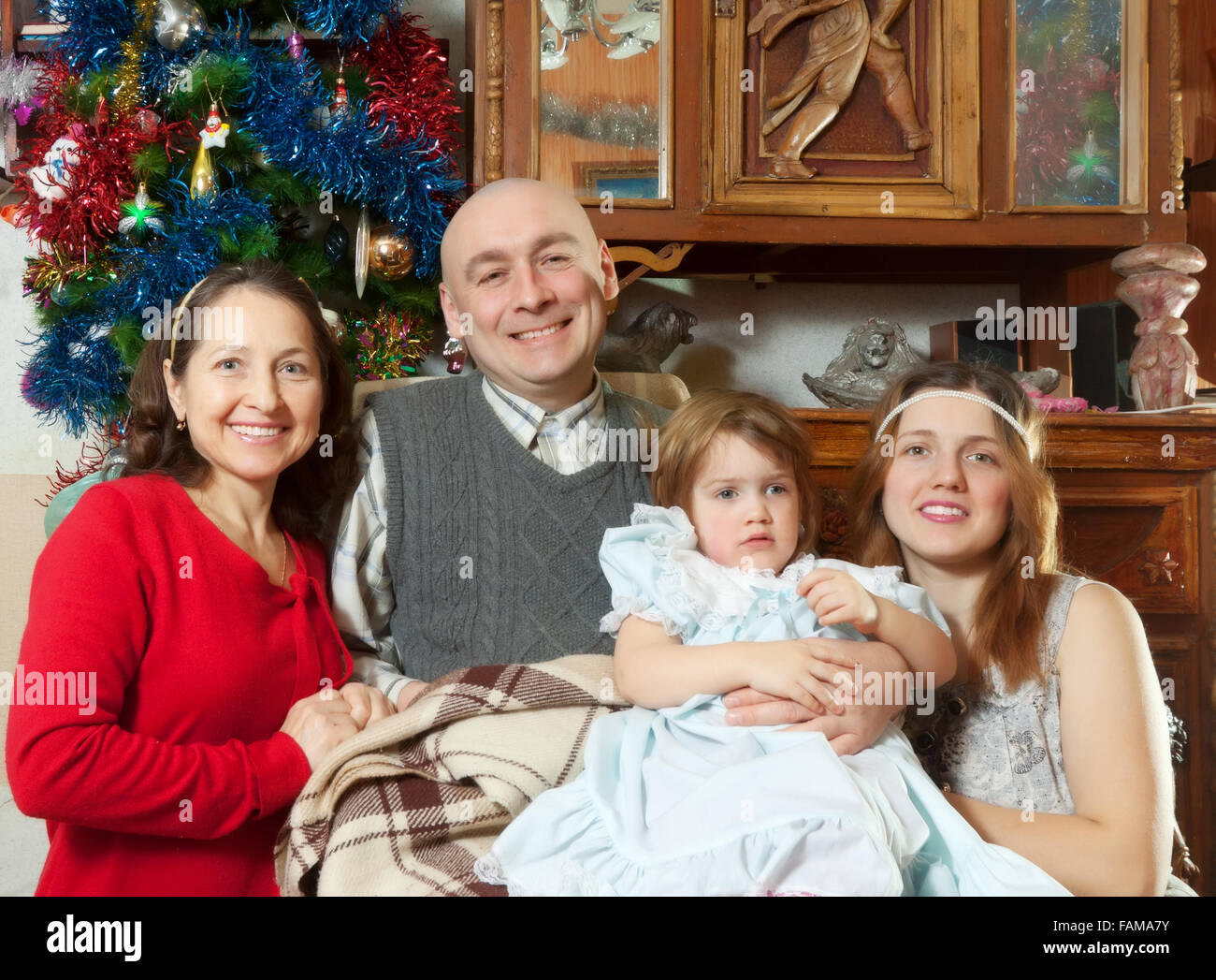 three generations family at home together during Christmas Stock Photo ...