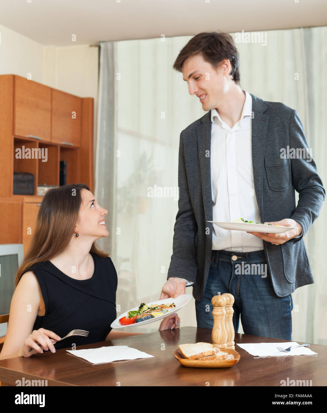 Man and woman having romantic dinner with wine Stock Photo - Alamy