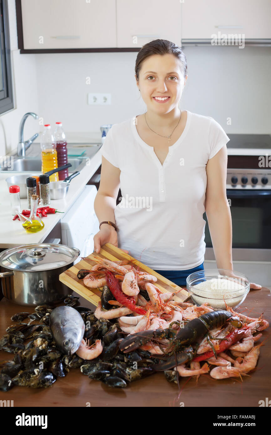woman cooking seafood and fish in kitchen Stock Photo - Alamy