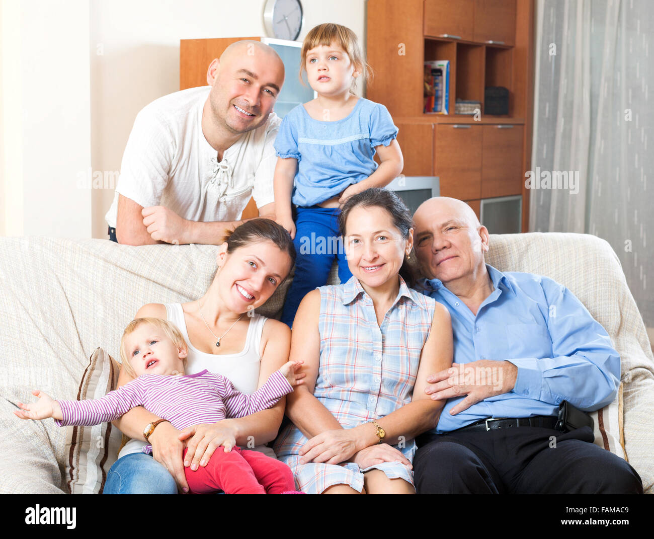 Portrait of happy multigeneration family with little children Stock ...