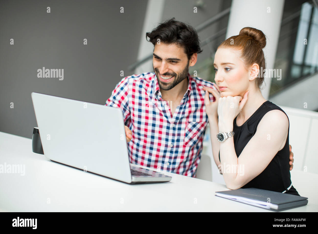 Young people in the office Stock Photo - Alamy