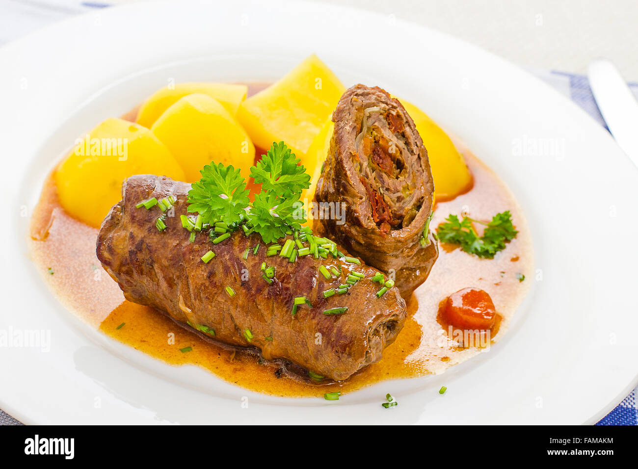 Sliced roulades beef with vegetable filling, potato close up Stock ...