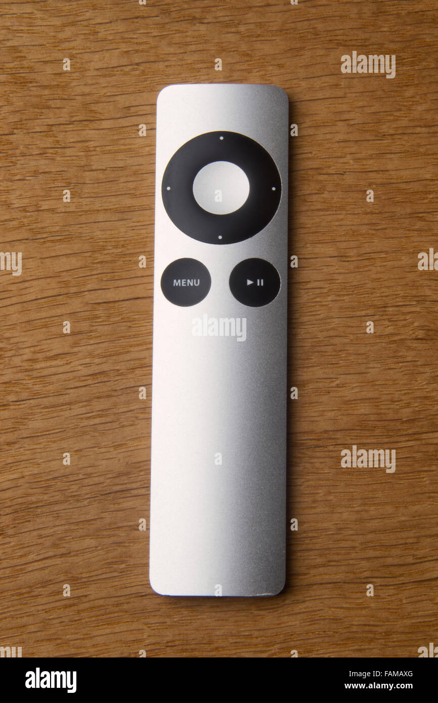 Apple TV remote controller on a wooden background Stock Photo - Alamy