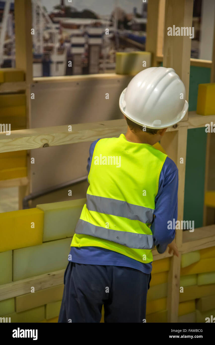 Boy builds a house at playground Stock Photo - Alamy