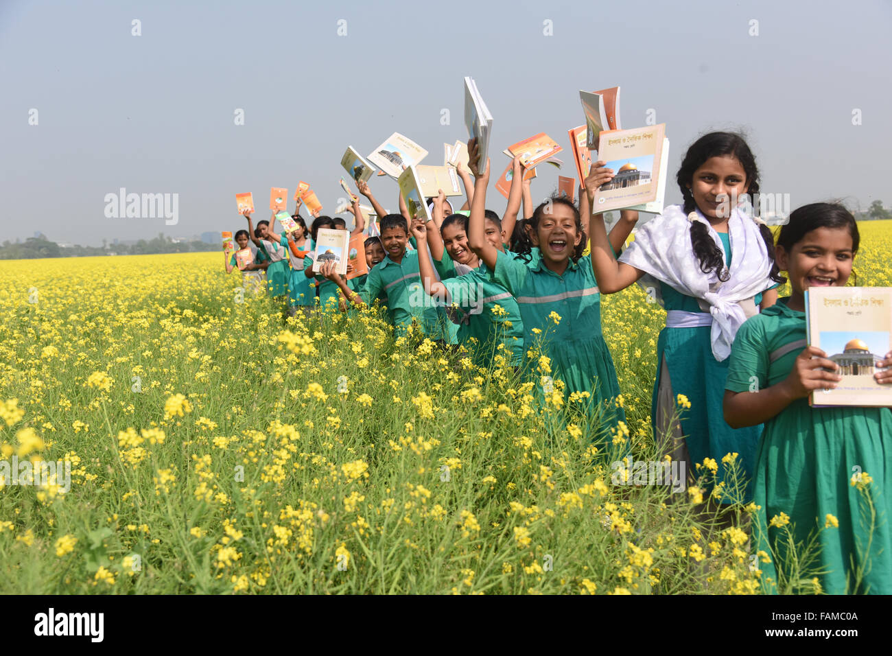 Dhaka, Bangladesh. 01st Jan, 2016. Bangladeshi School Students going to home with new textbooks ...