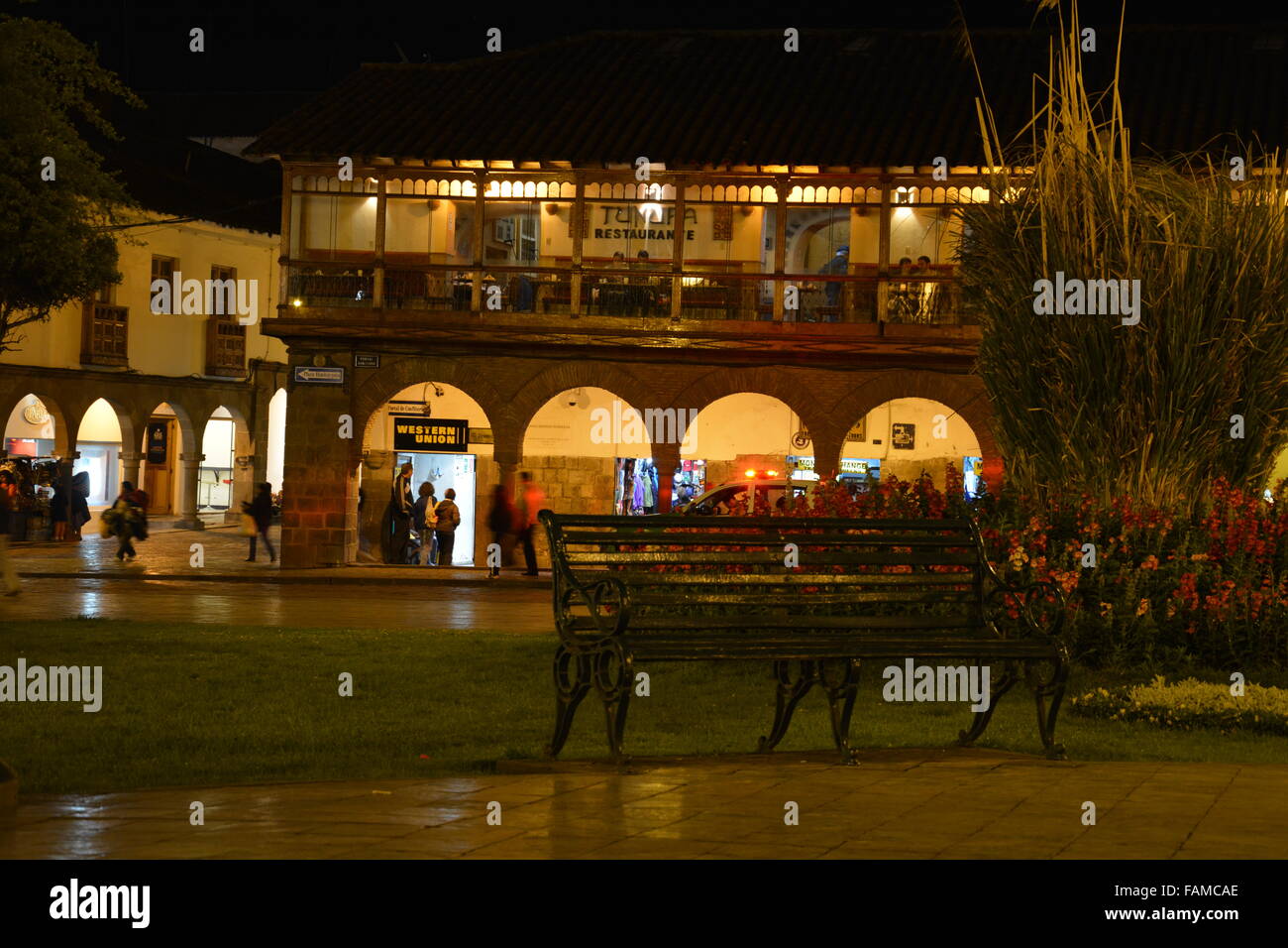 Park bench in the Plaza de Armas at night in the city of Cusco, Peru ...