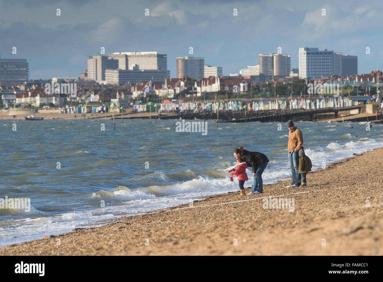 A family on the beach at Thorpe Bay in Southend on Sea in Essex, UK ...