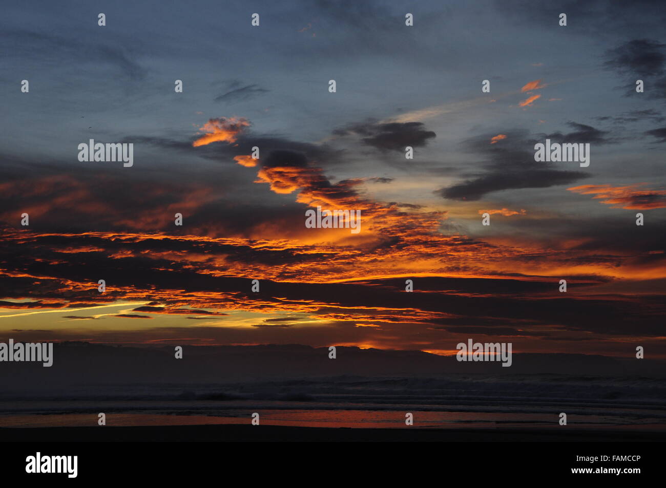 sunset over the sea spectacular sky Stock Photo - Alamy