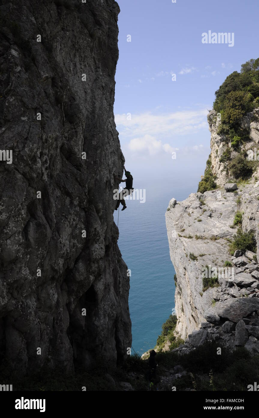 climbing action coast coastal wall Stock Photo - Alamy