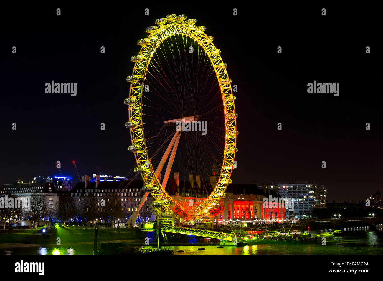 London, UK. 31st Dec, 2015. The many colours of the London Eye as seen ...