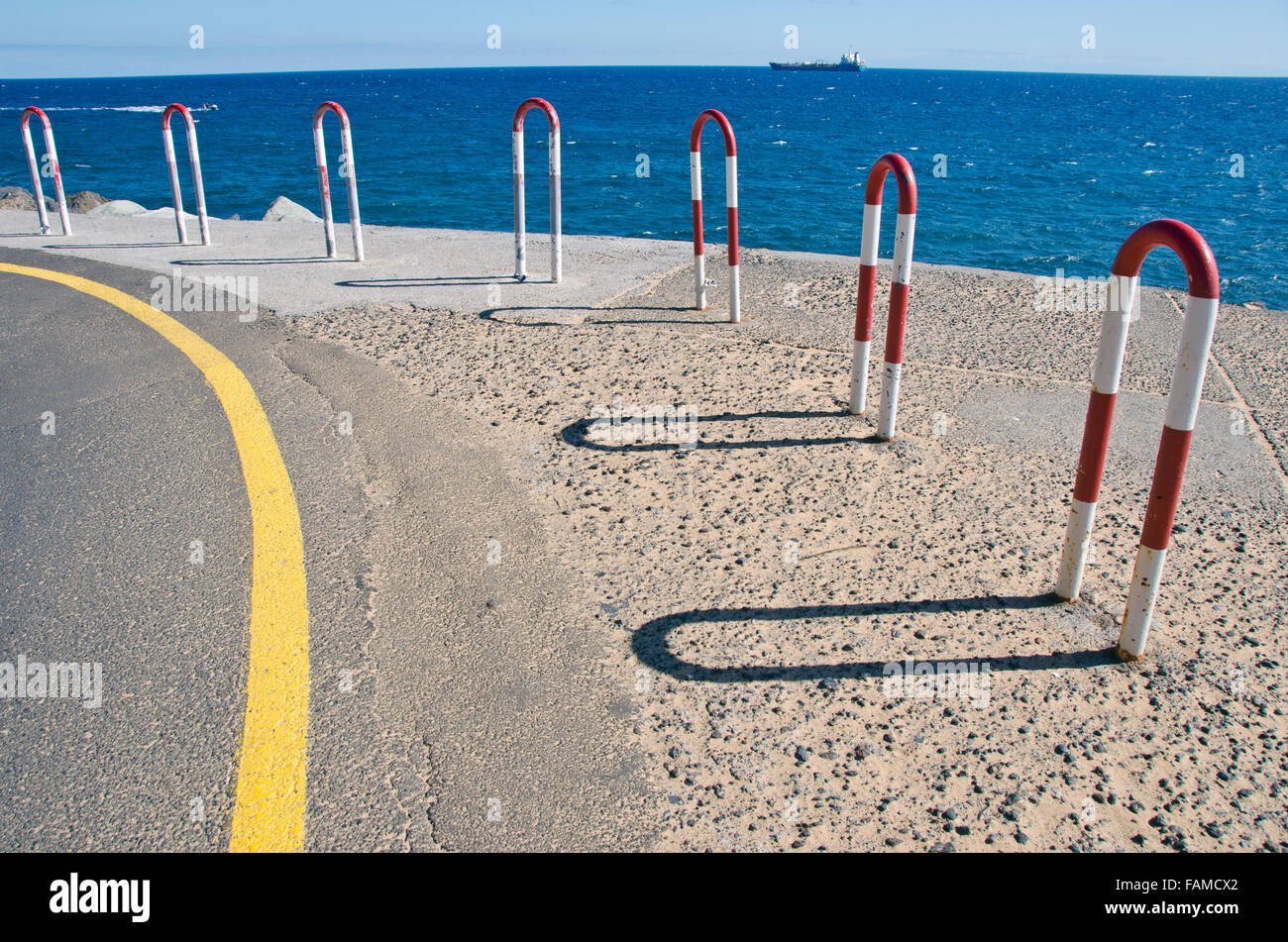 Seascape with a ship and pier with metal fence Stock Photo - Alamy