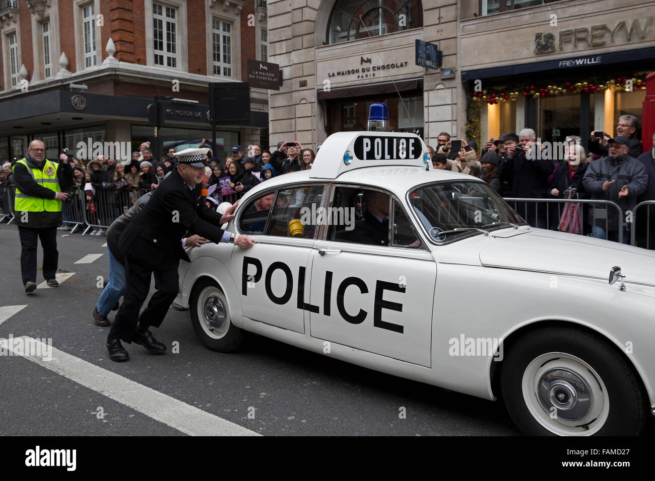 London, UK. 1st January, 2016. An old Jaguar Police car broke down and ...