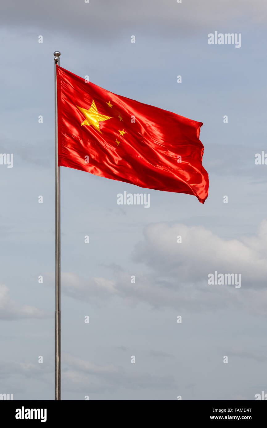 Chinese flag blowing in wind Stock Photo - Alamy