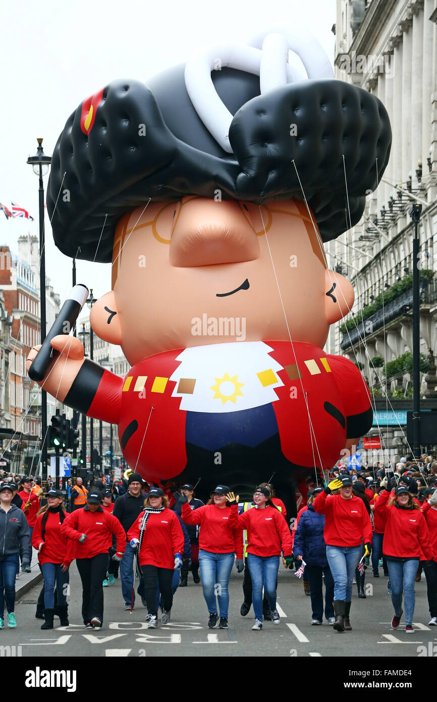 London, UK. 1st January 2016. A giant inflatable Town Crier is led ...
