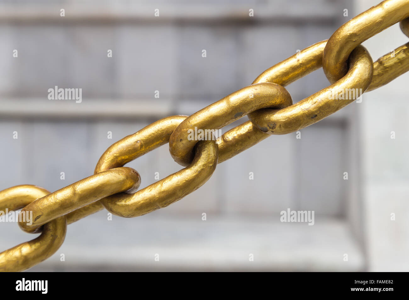 Gold chain is stretched on posts to be a wall of restricted area at ...