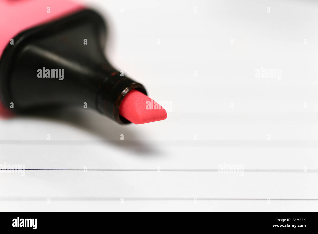 Pink highlight pen on straight line white pad Stock Photo - Alamy