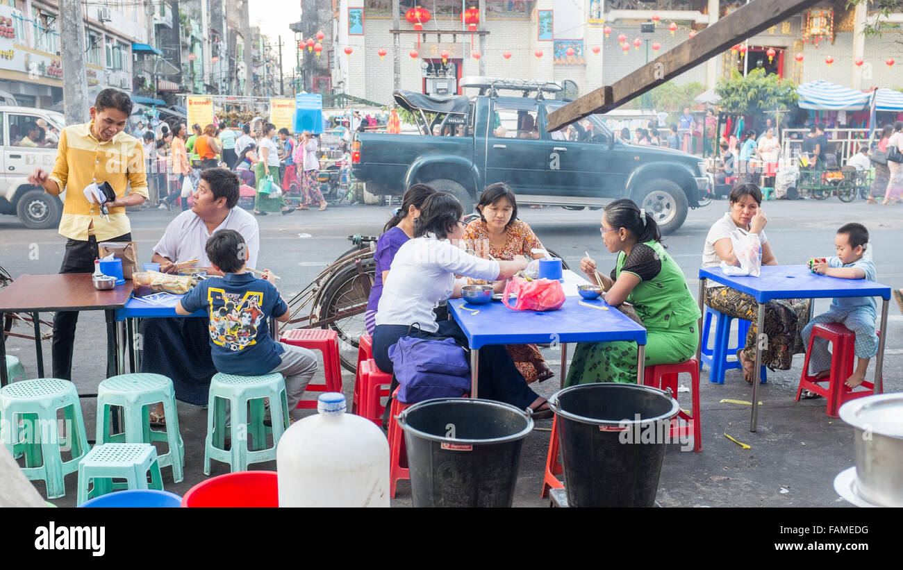 Burmese street scene in Chinatown of Yangon Stock Photo - Alamy