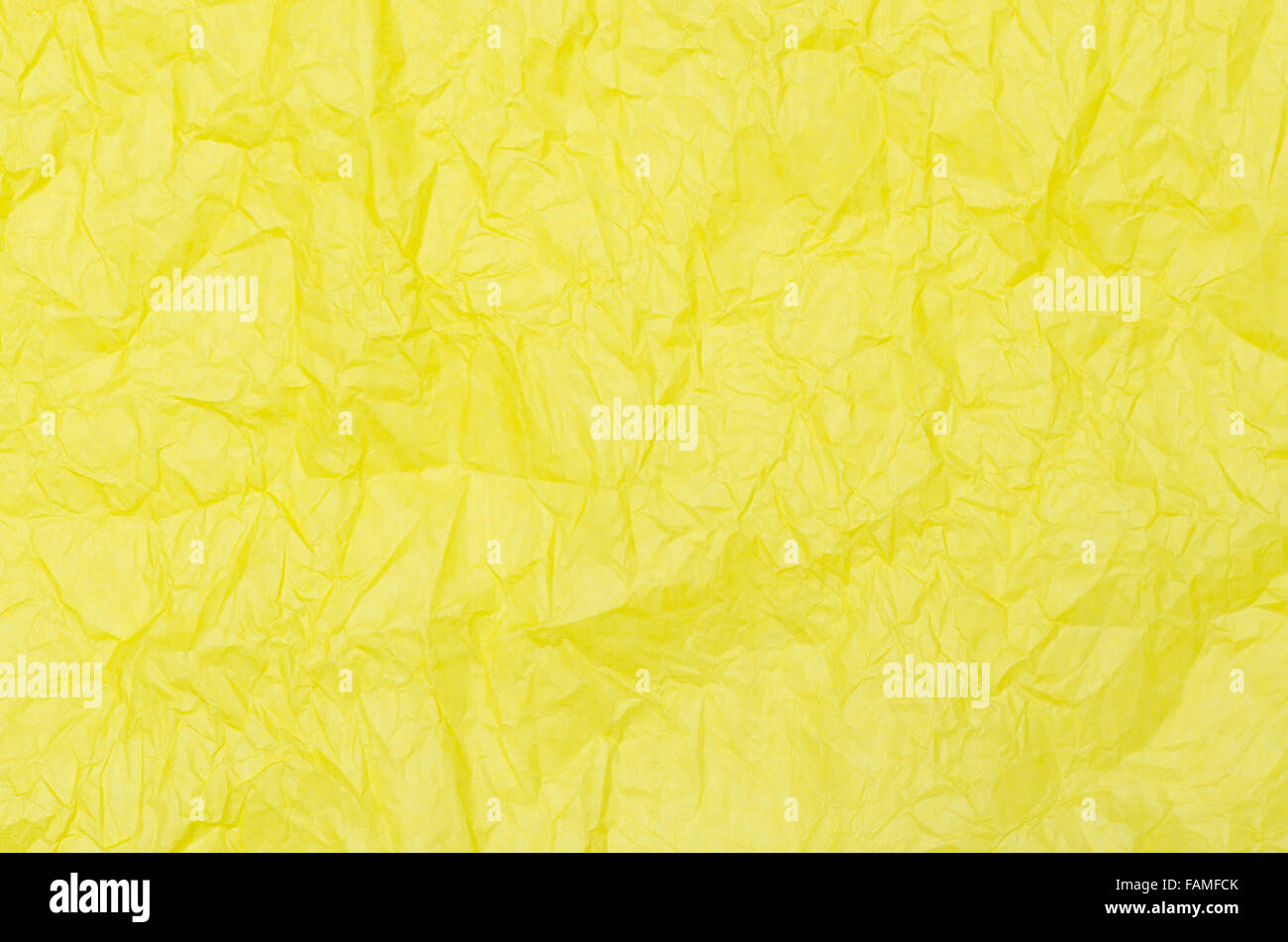 yellow creased tissue paper background texture Stock Photo - Alamy