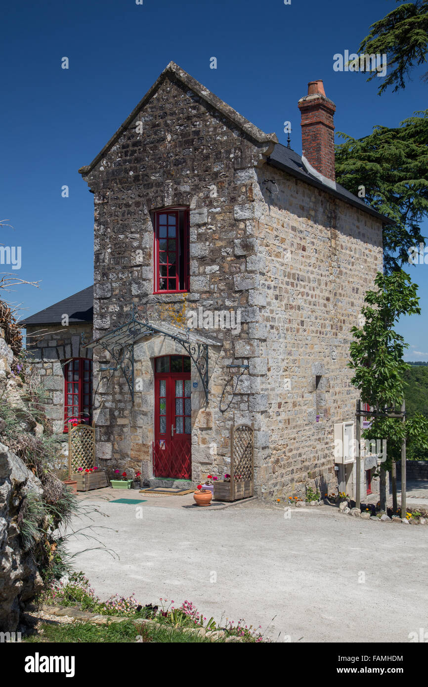 The historic medieval gate house and entrance to Domfront Castle, in ...